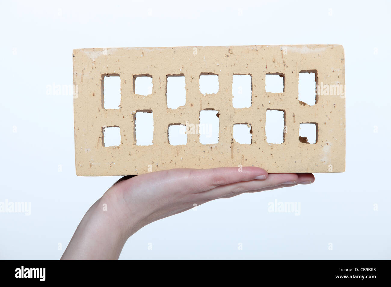 Brick on a hand Stock Photo - Alamy