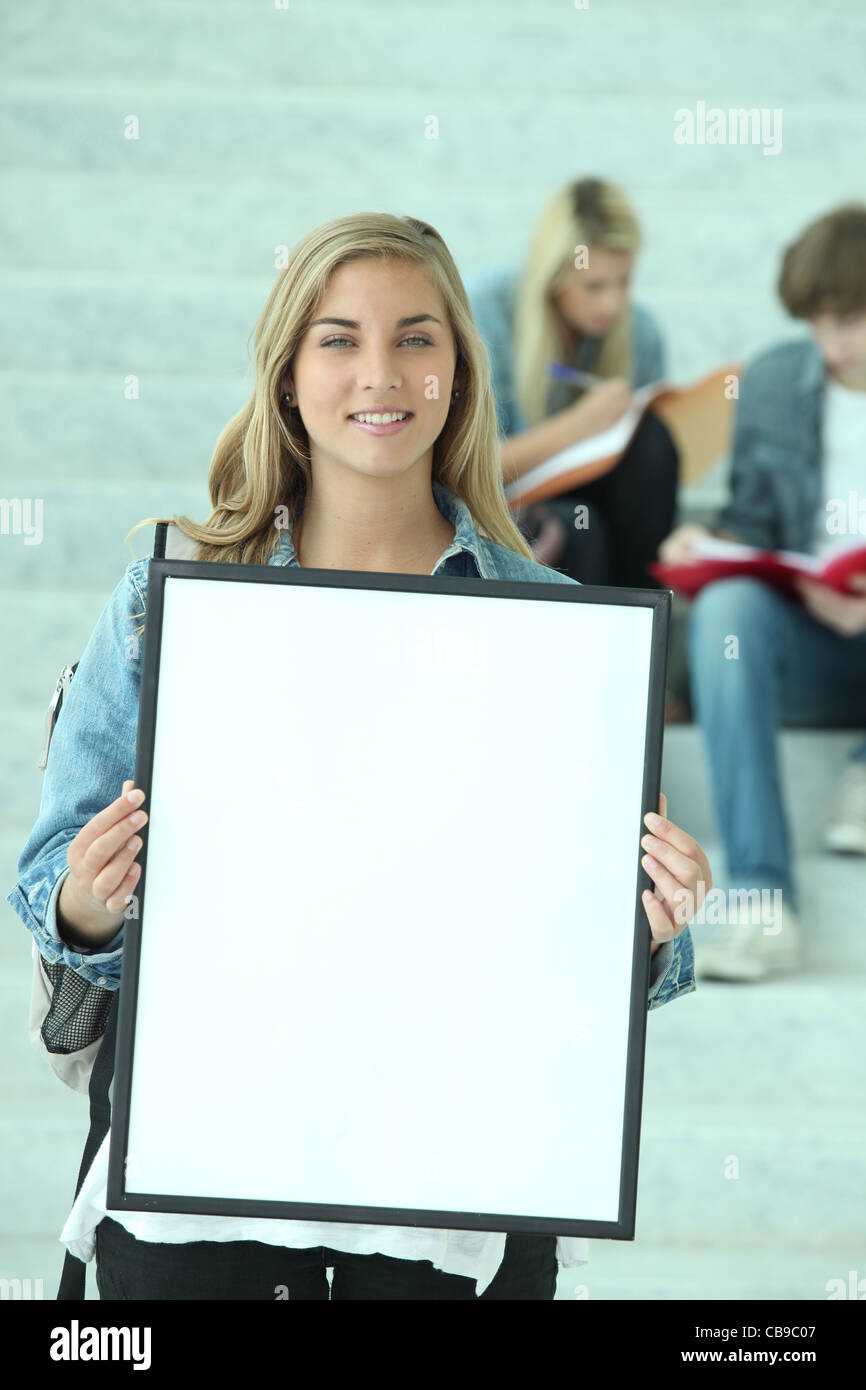 Student and white placard Stock Photo - Alamy