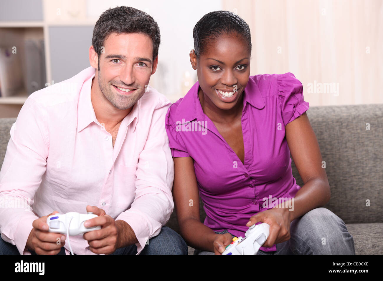 Couple playing computer games Stock Photo - Alamy