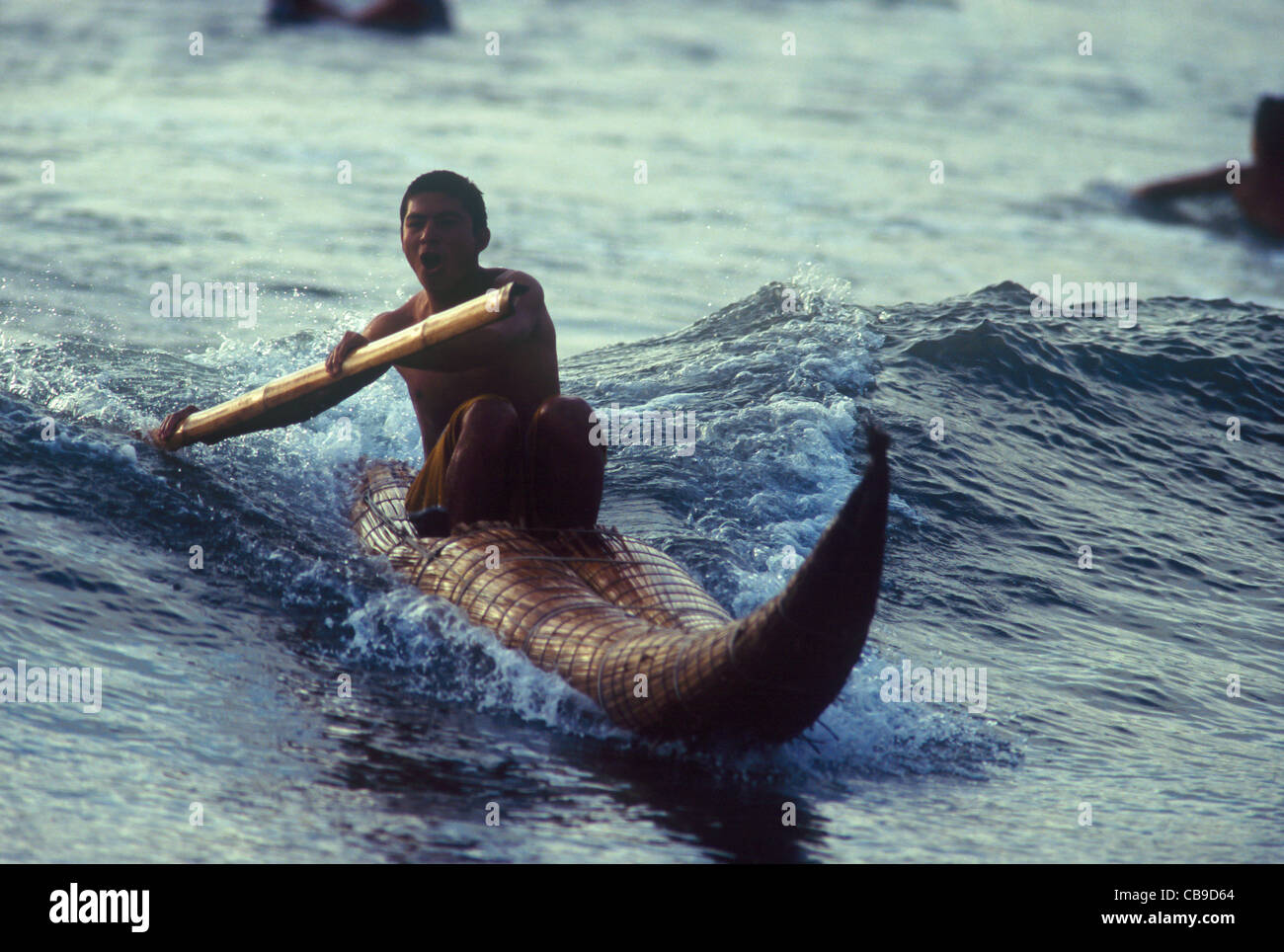 Caballitos de Totora reed boat fishermen surfing a small wave for fun ...