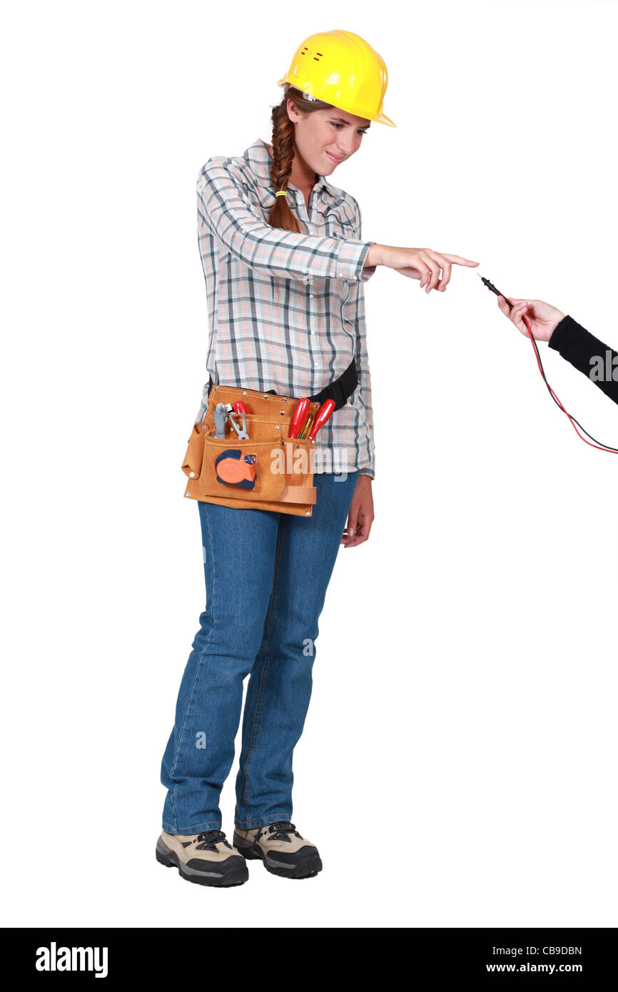 Female laborer touching an electrical wire Stock Photo - Alamy