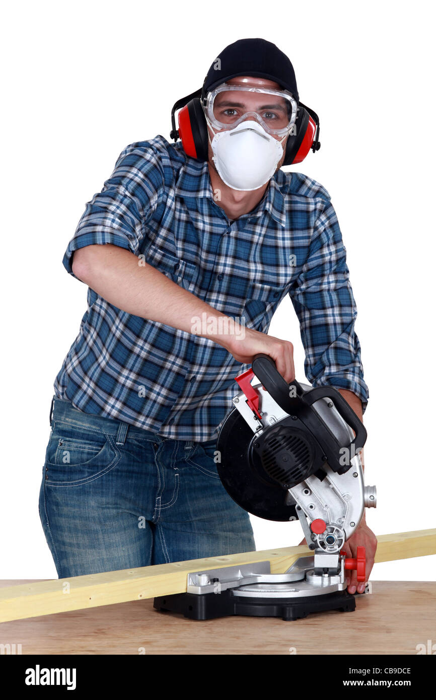 A carpenter with a circular saw Stock Photo - Alamy
