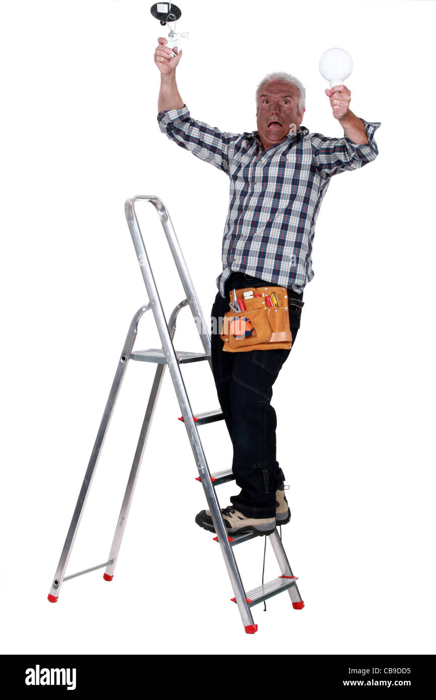 Man getting electric shock Cut Out Stock Images & Pictures - Alamy