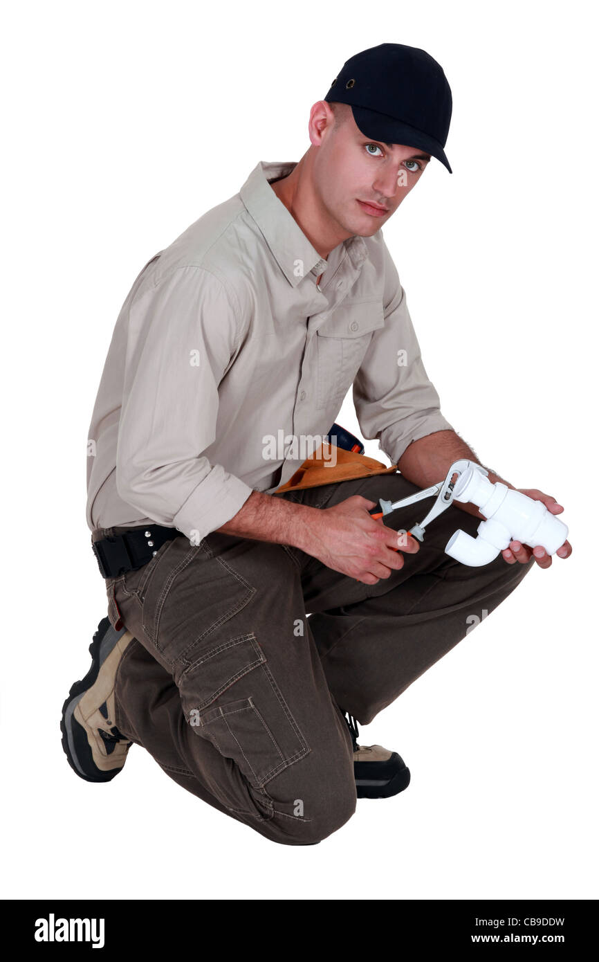 Professional plumber fixing water Cut Out Stock Images & Pictures - Alamy