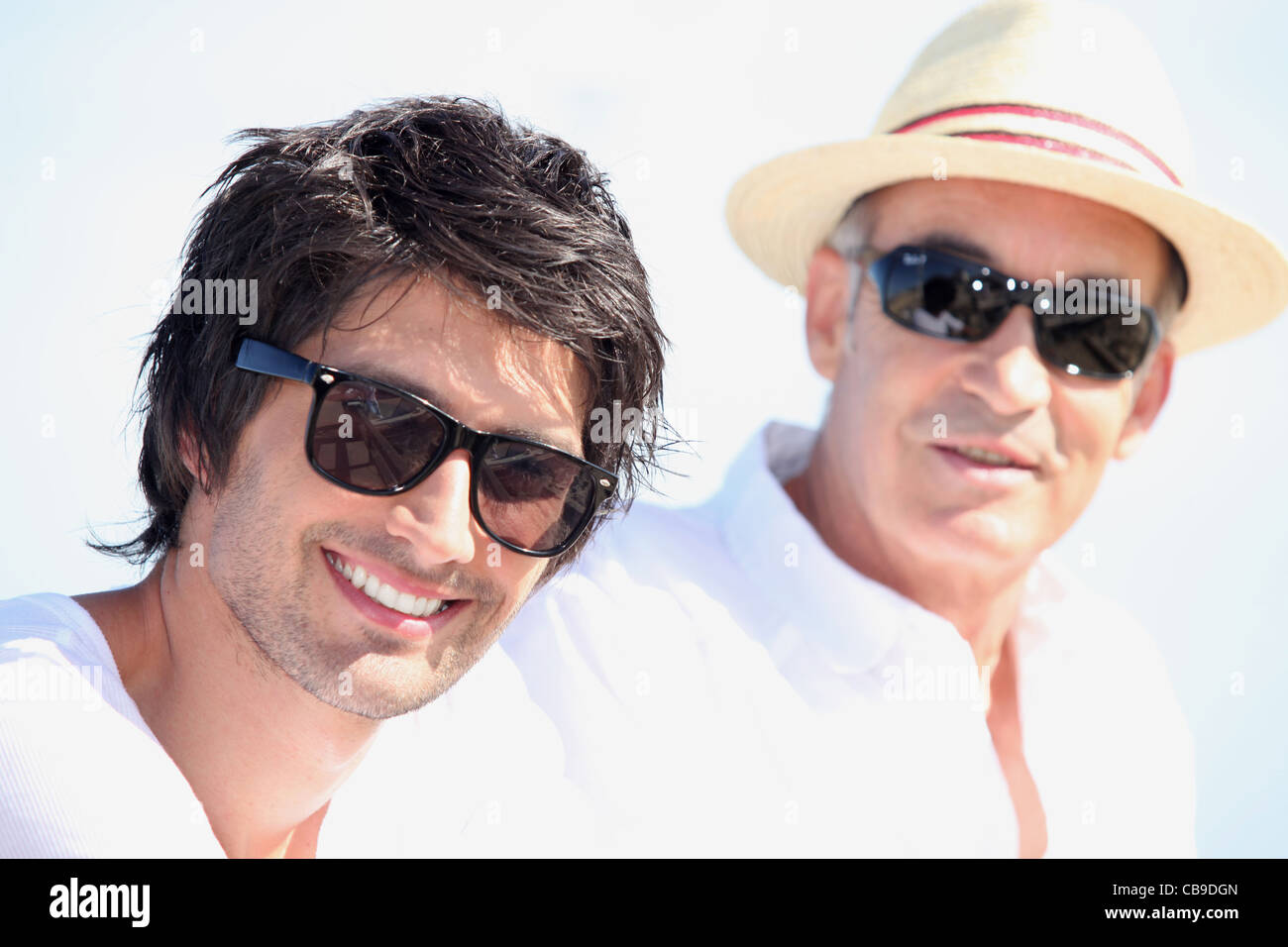couple of men enjoying the sun Stock Photo - Alamy