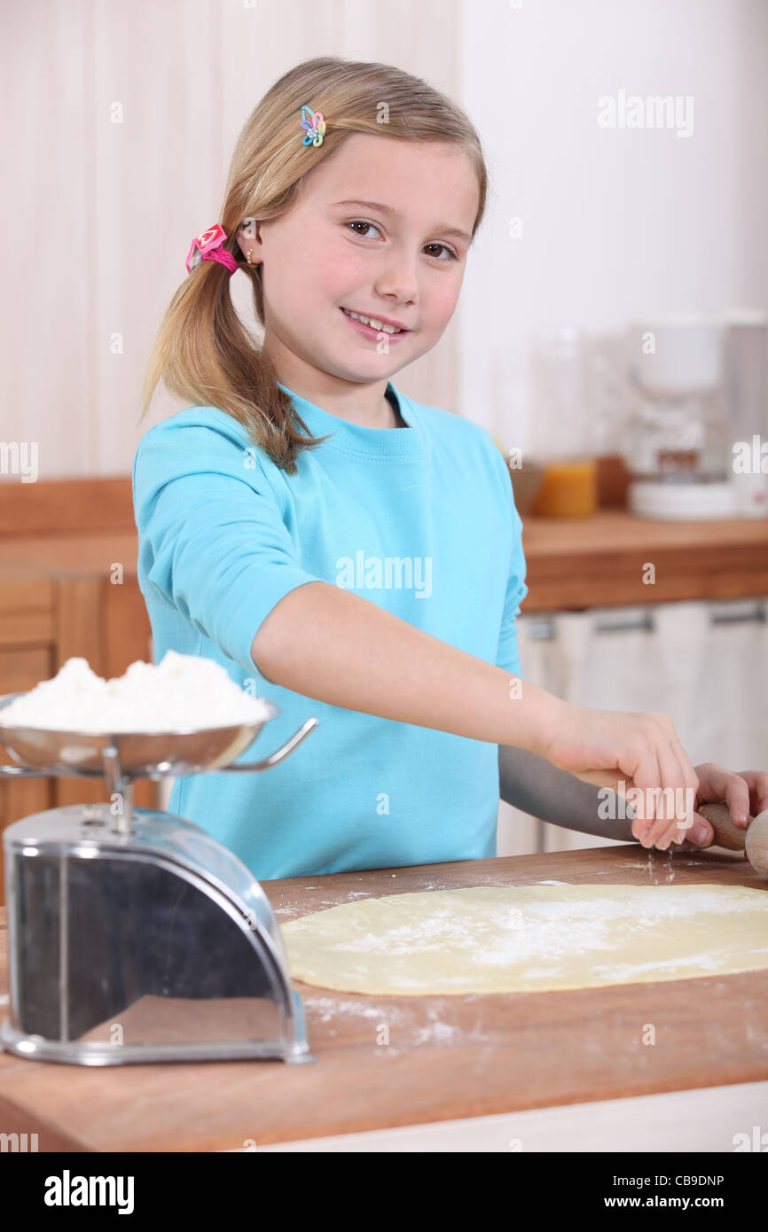 Girl making pizza dough Stock Photo - Alamy