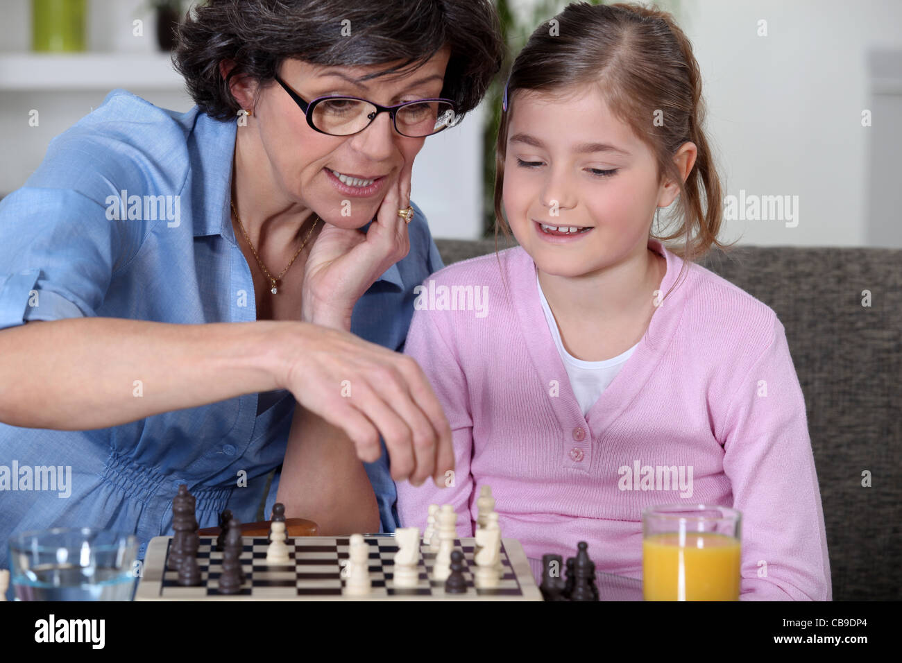 A mother and her daughter playing chess Stock Photo - Alamy