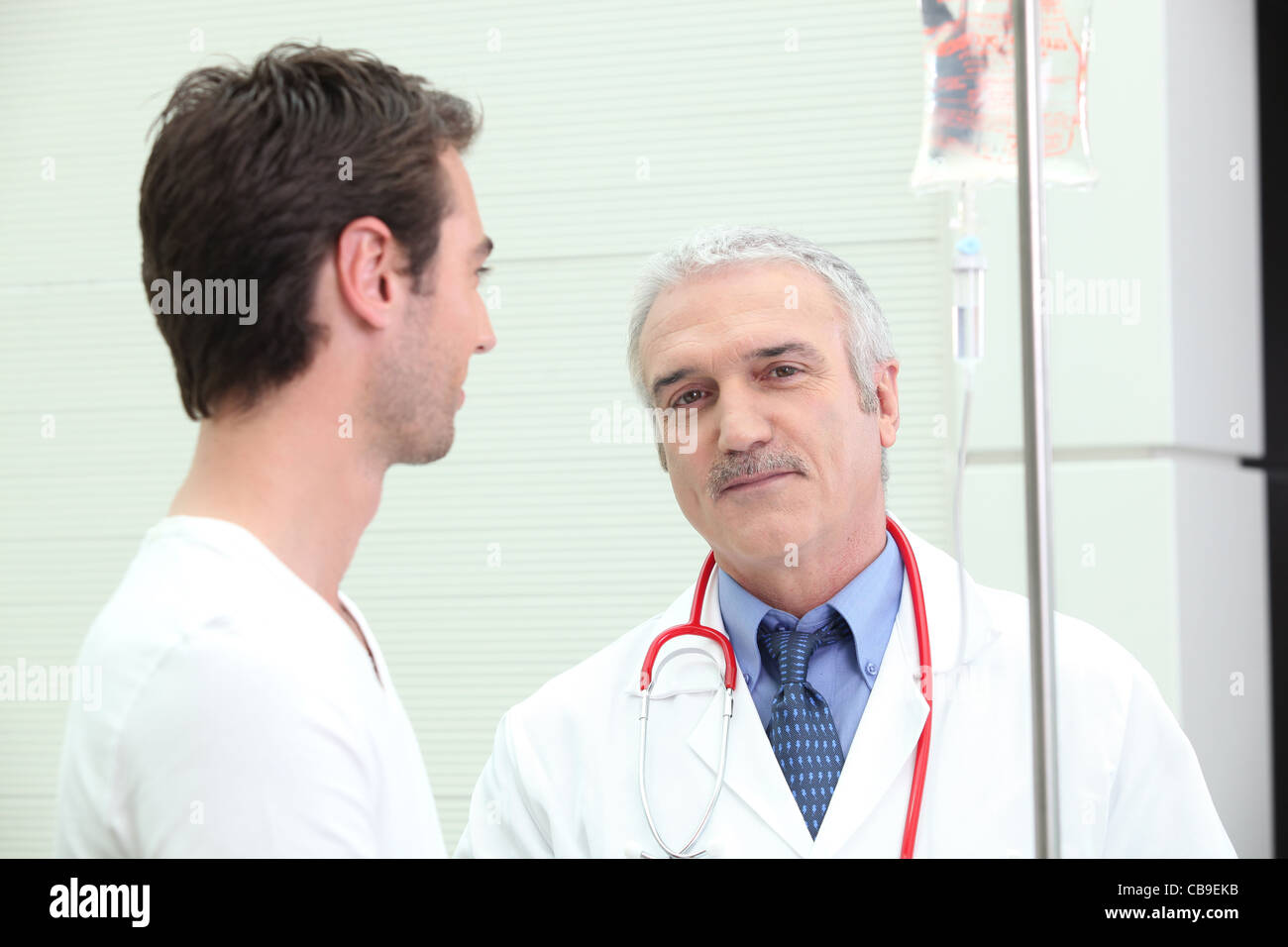 Doctor talking to patient Stock Photo - Alamy