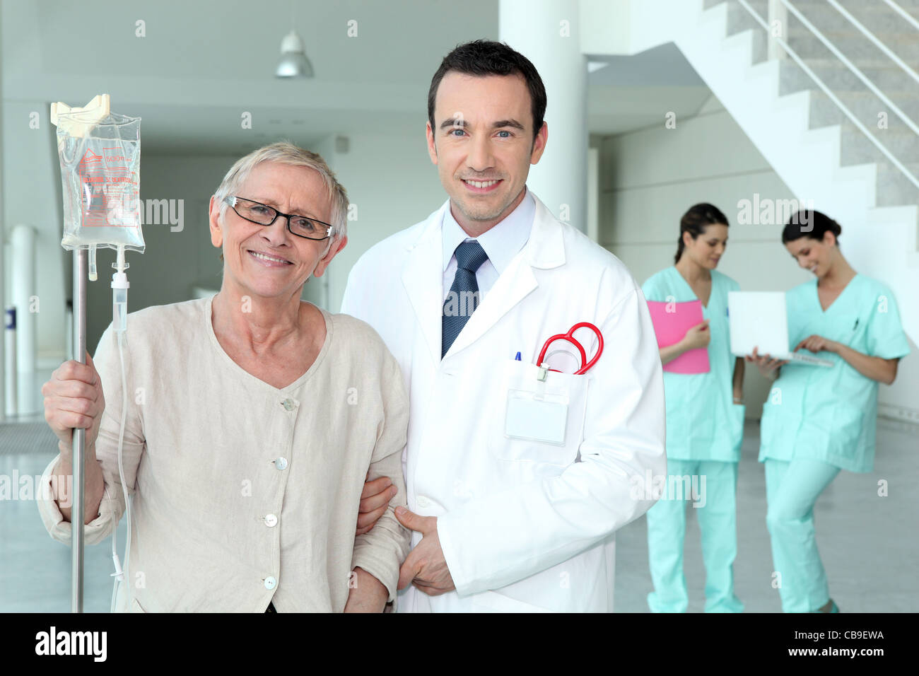 Doctor helping his patient walk Stock Photo - Alamy