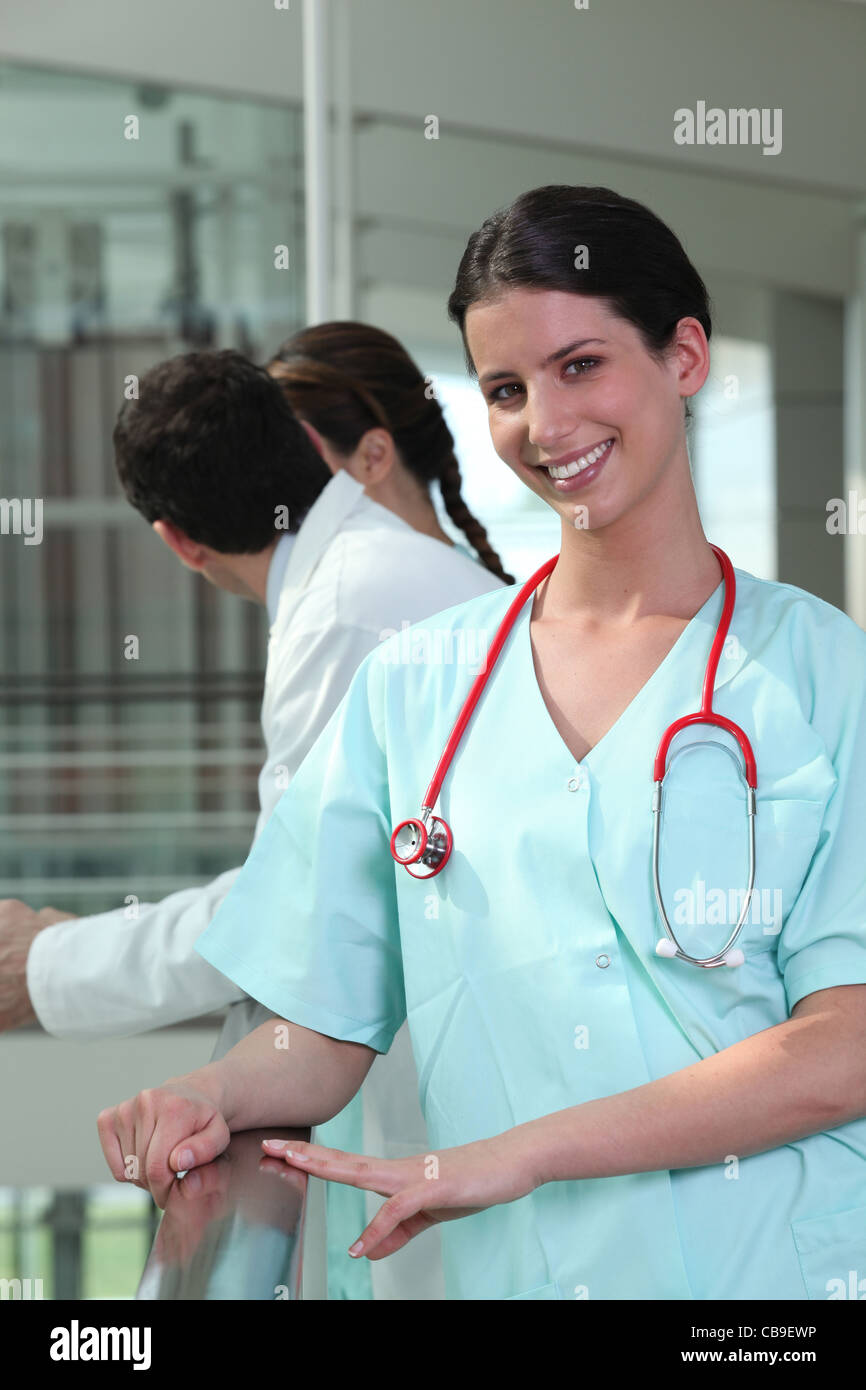 Doctor taking a break with her colleagues Stock Photo - Alamy