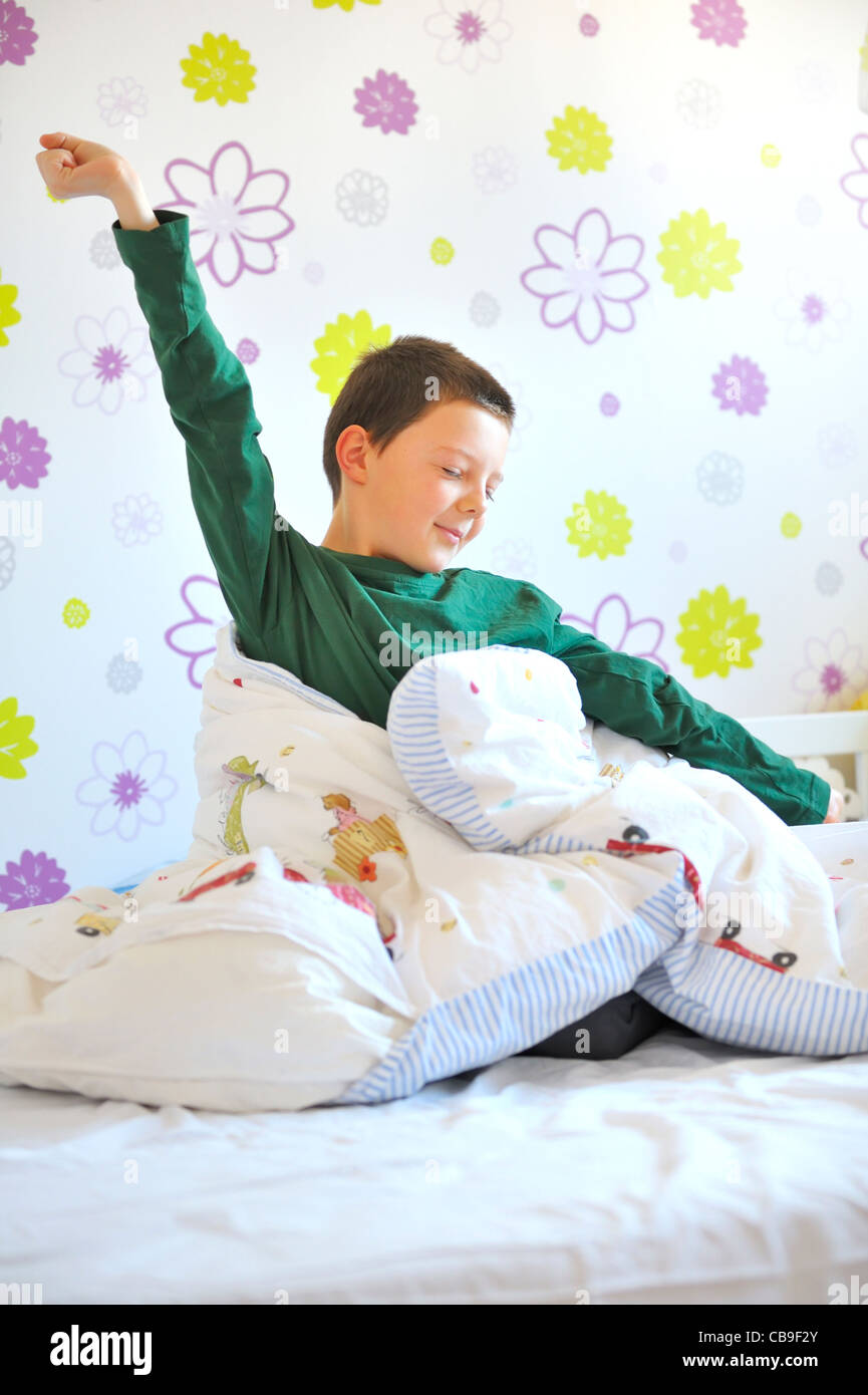 boy awakeing in his bed Stock Photo - Alamy