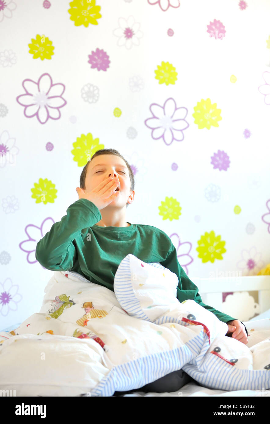 boy awakeing in his bed Stock Photo - Alamy