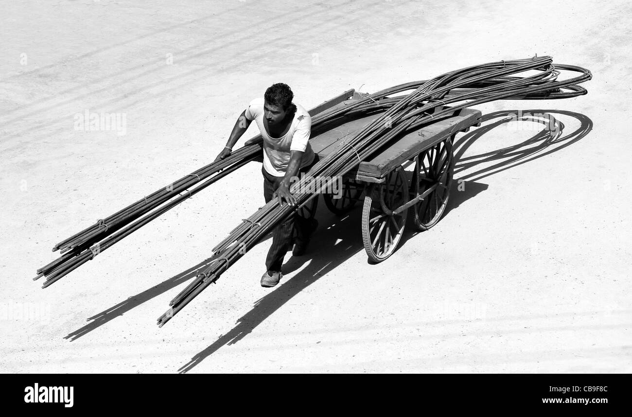 Pushing a heavy load hi-res stock photography and images - Alamy