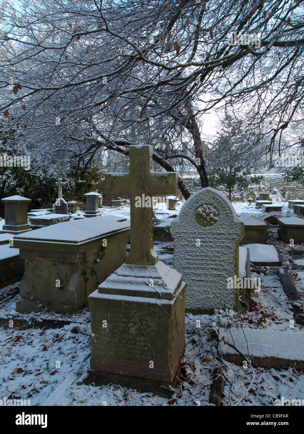 Graveyard in winter with snow and ice Stock Photo - Alamy