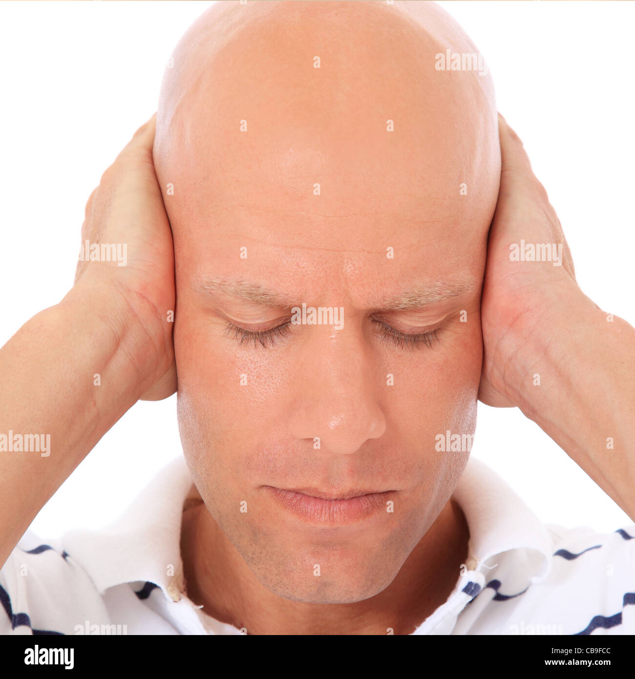 Attractive man keeps his ears shut. All on white background Stock Photo ...