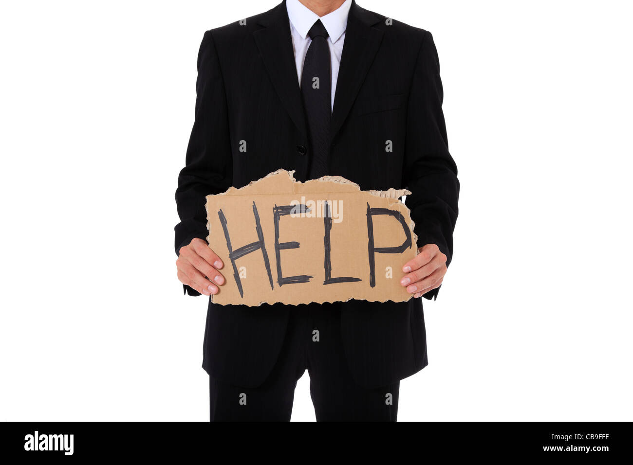 Businessman holding cardboard sign showing the term help. All on white ...