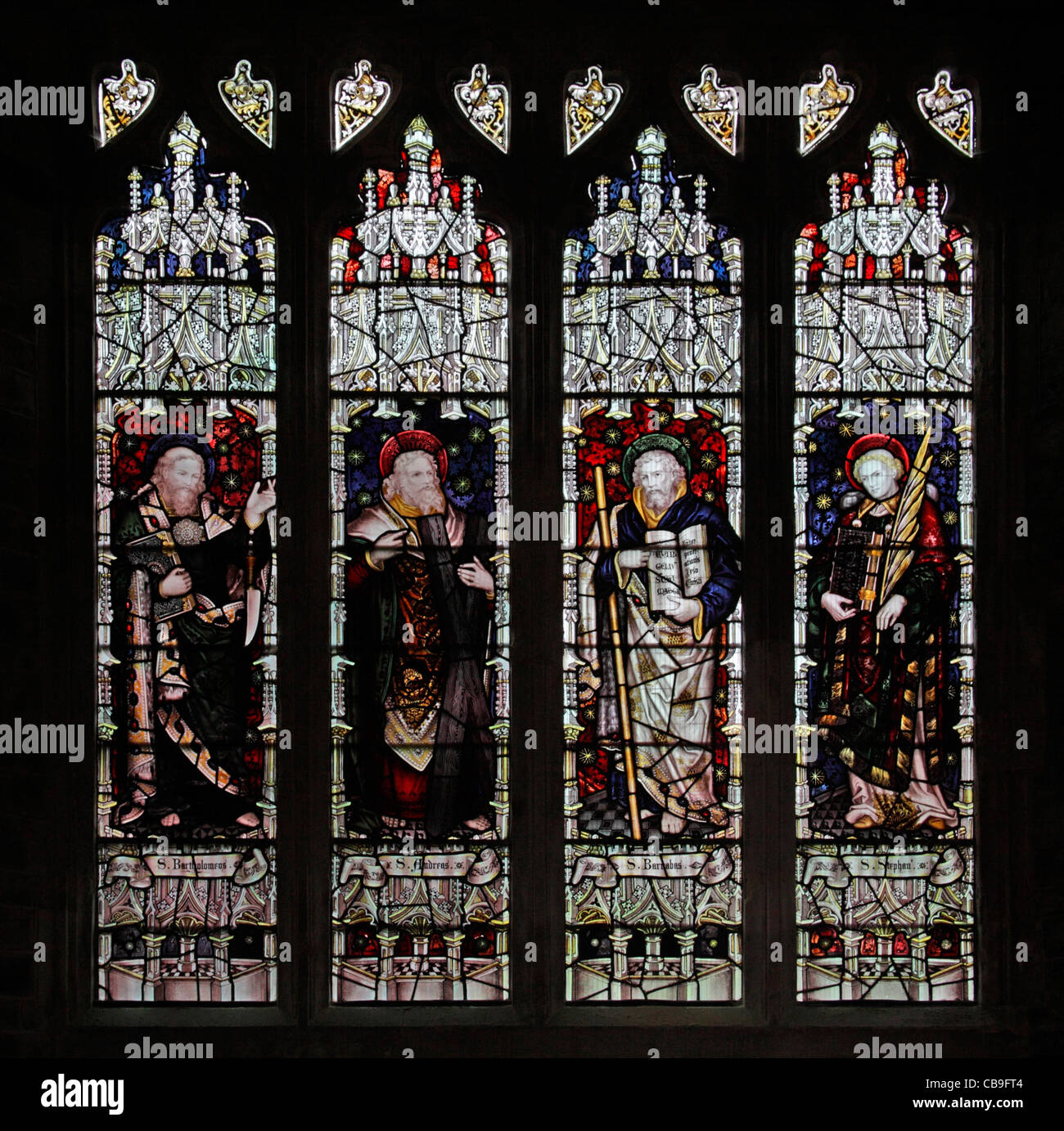 A stained glass window by the Kempe Studios depicting Saints ...