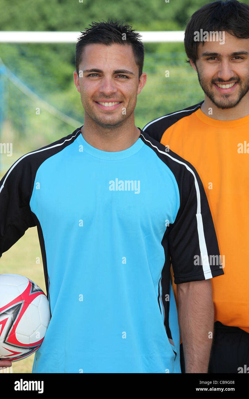 Football players smiling Stock Photo - Alamy