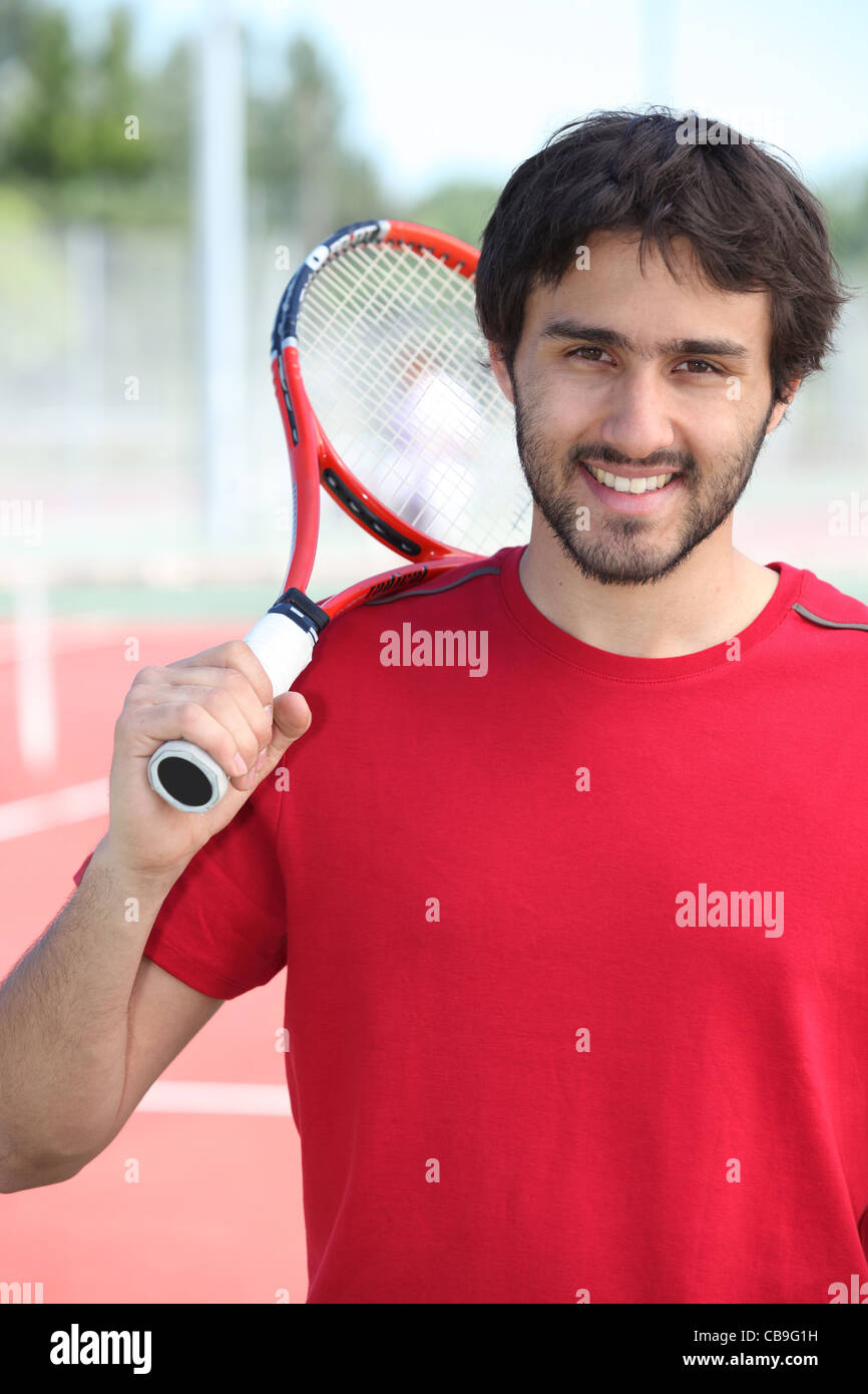 Tennis player holding racket Stock Photo - Alamy