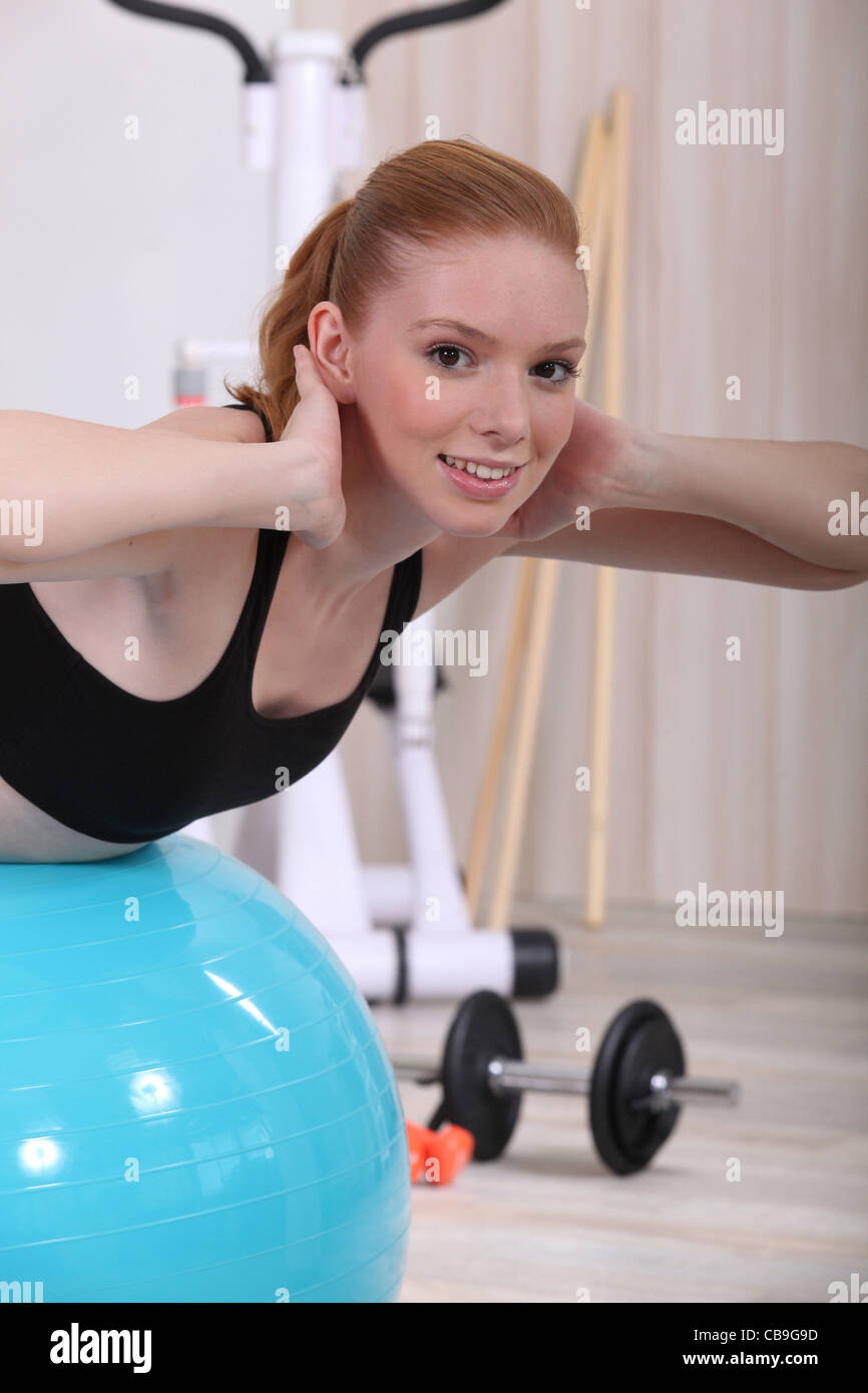 young woman doing stability ball abs exercises Stock Photo - Alamy