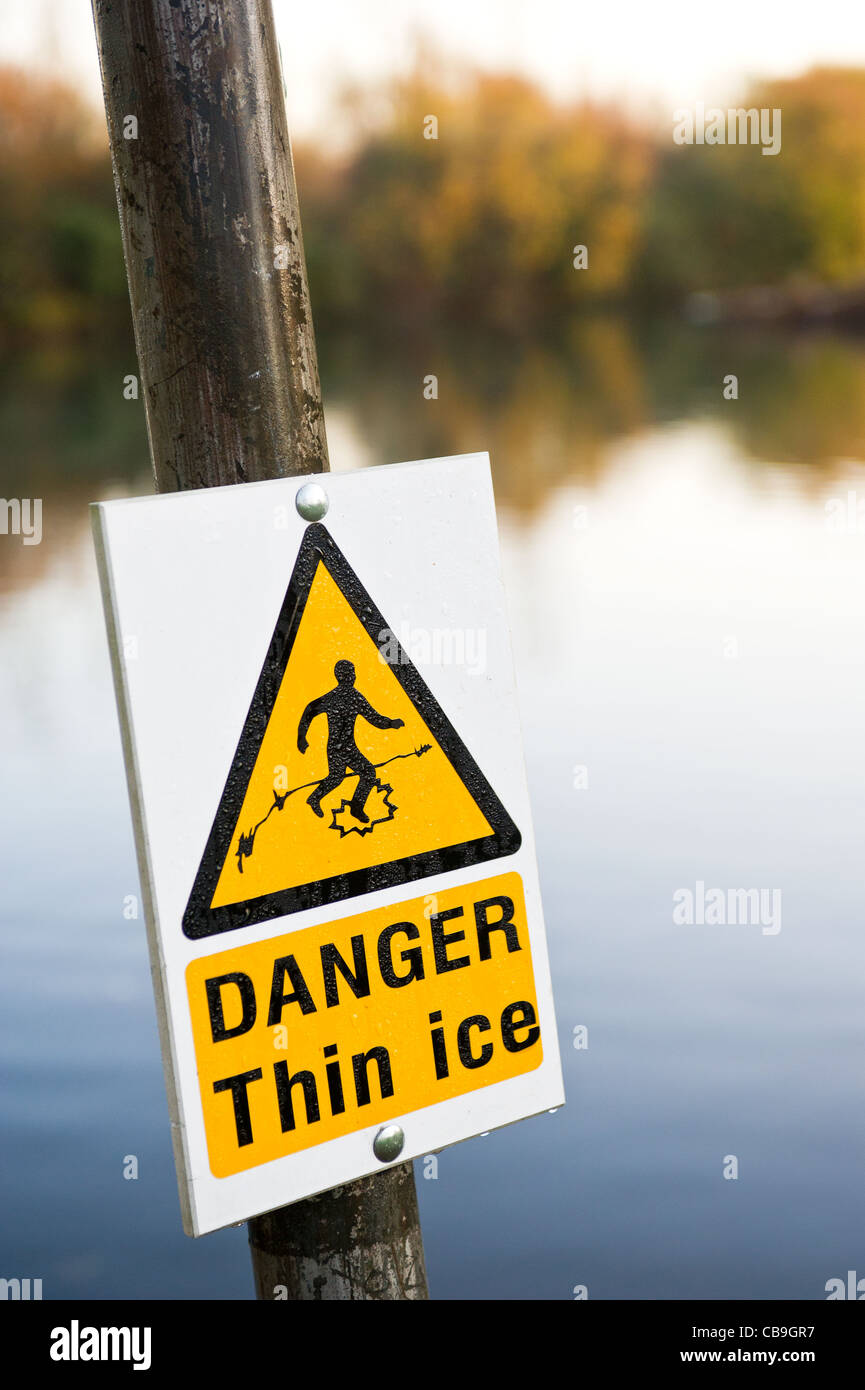 A sign warning about the danger of thin ice Stock Photo - Alamy