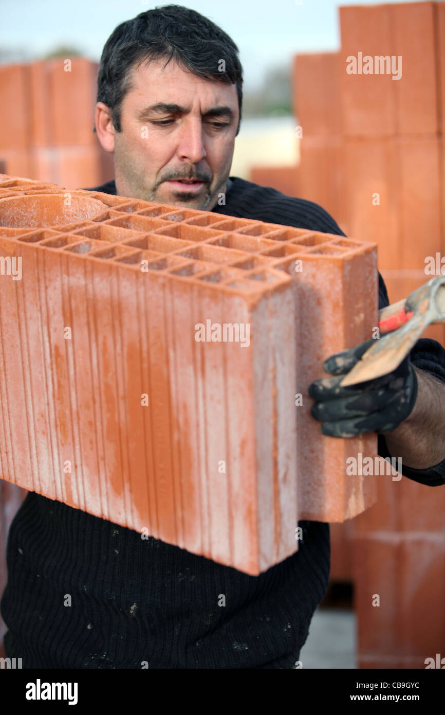 Bricklayer on site Stock Photo - Alamy