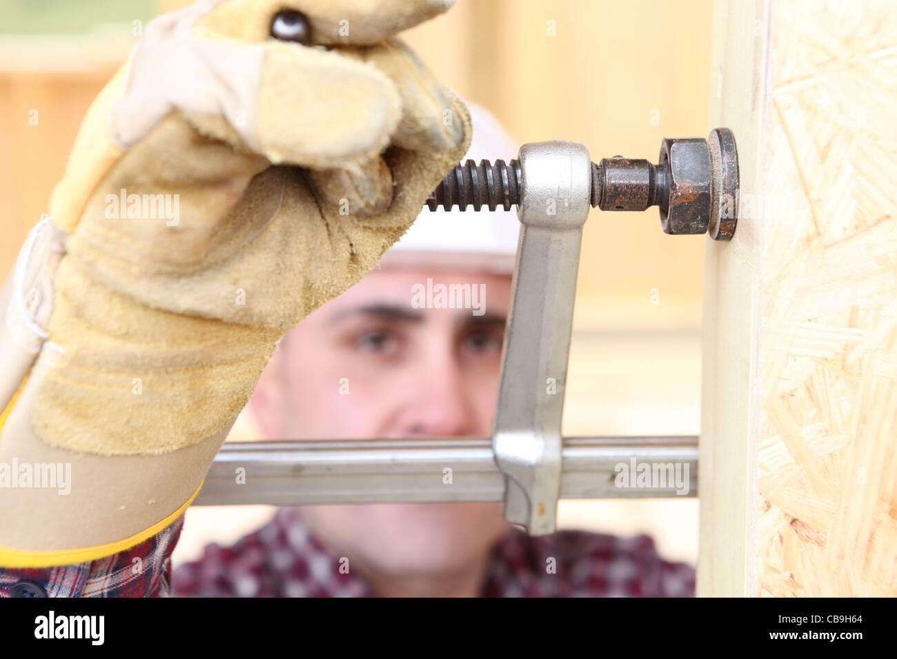 Man using vice to secure wood Stock Photo - Alamy