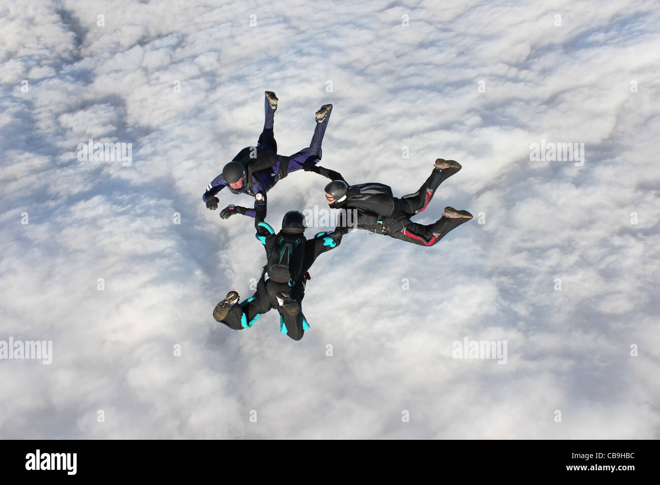 Three skydivers in freefall Stock Photo - Alamy