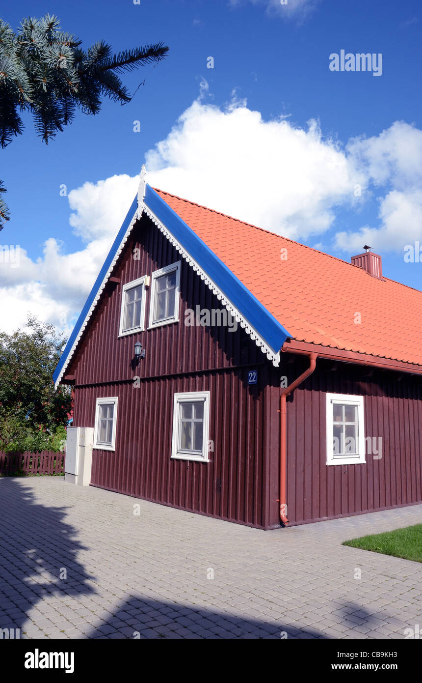 Colorful house details. Brown house with red tailed roof Stock Photo ...