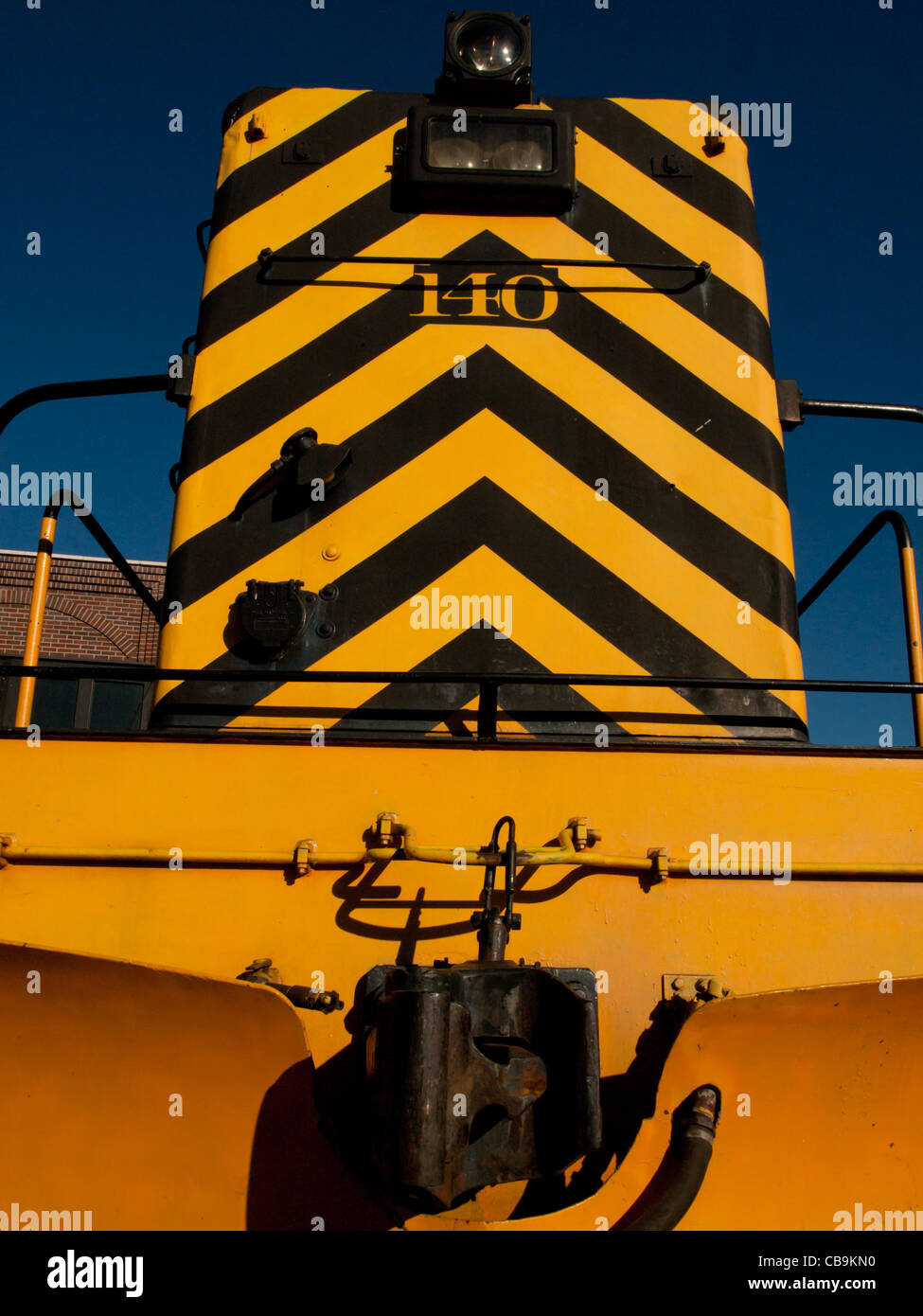 Vintage yellow locomotive at front of the roundhouse Stock Photo - Alamy