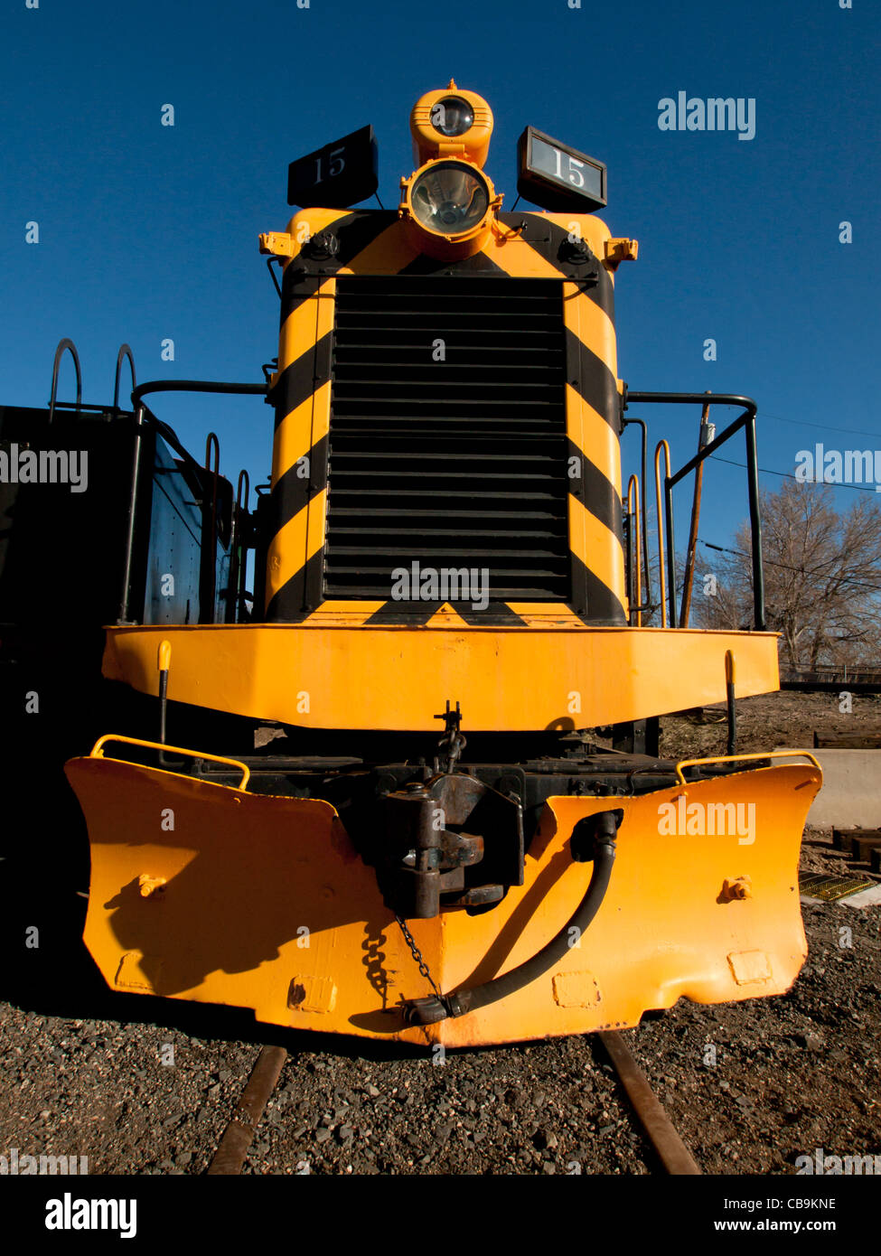 Vintage yellow locomotive at front of the roundhouse Stock Photo - Alamy
