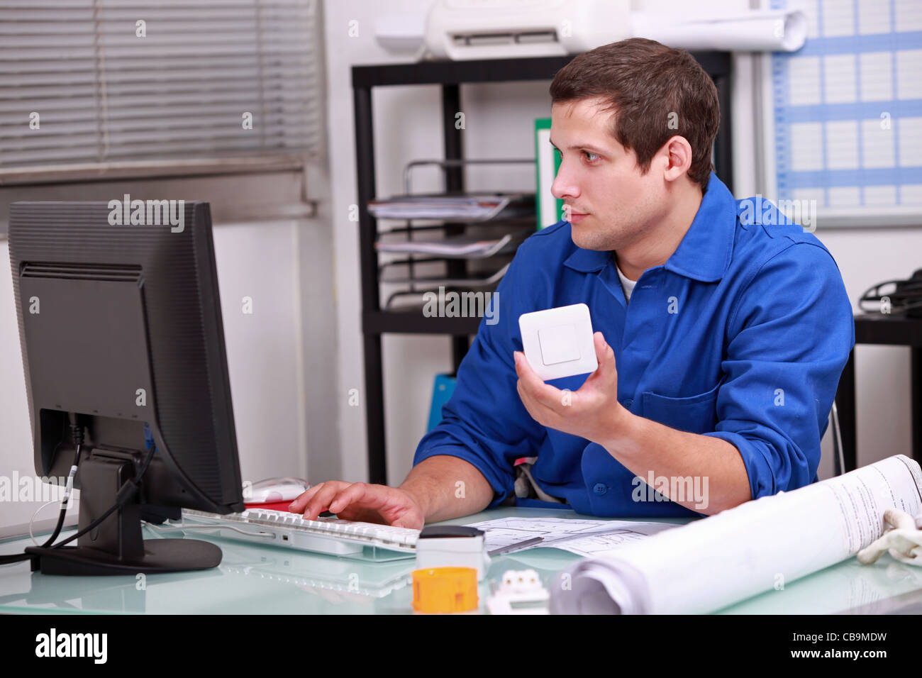 Man checking stock Stock Photo - Alamy