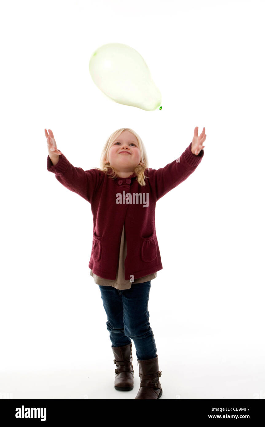 young girl playing with a balloon balloons air pressure lighter than ...