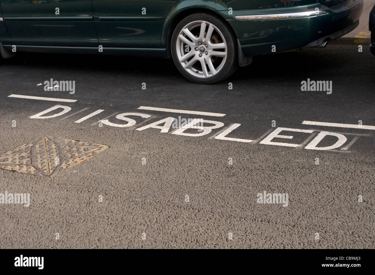 disabled parking bay space car Stock Photo - Alamy