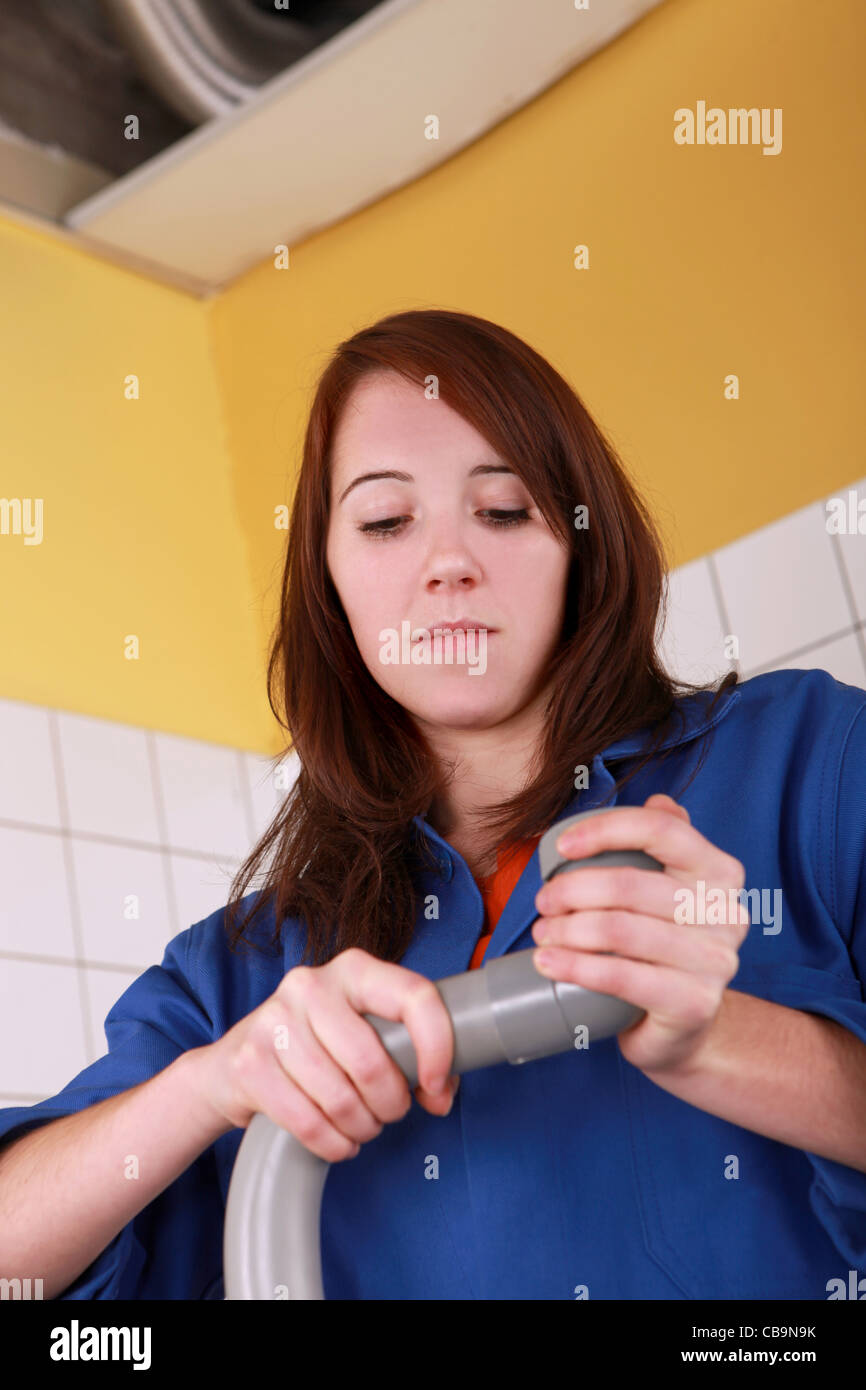 Female apprentice plumber Stock Photo - Alamy