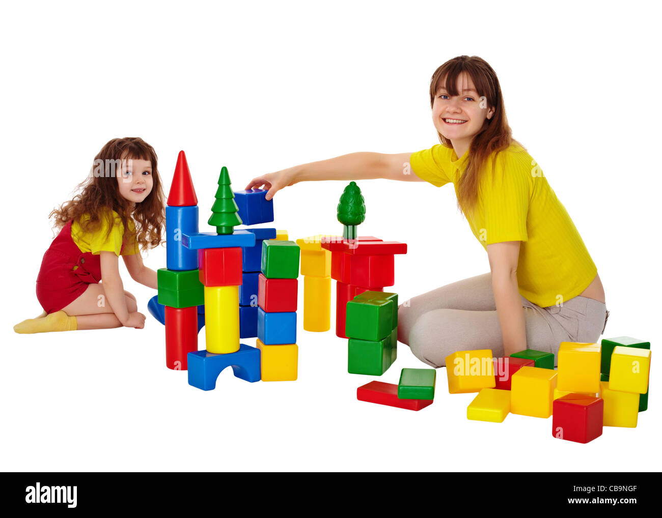 Happy mother and daughter playing with blocks isolated on white Stock ...