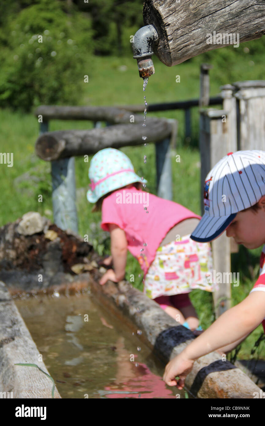 Kids enjoy playing water hi-res stock photography and images - Alamy
