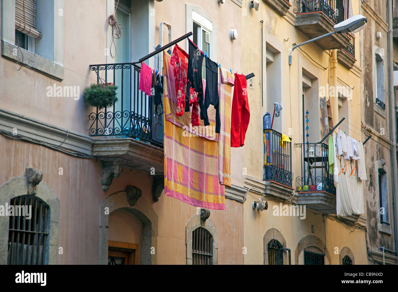 Laundry drying from balcony in the La Barceloneta quarter in Barcelona ...