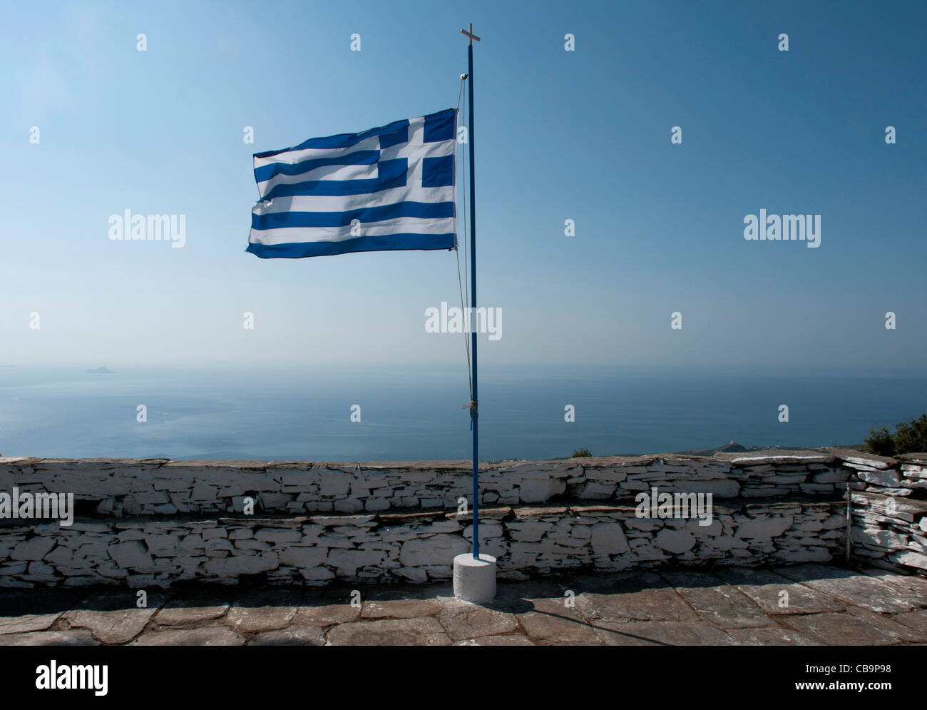 Greek flag flying over the Aegean sea, Ikaria island, Greece Stock ...