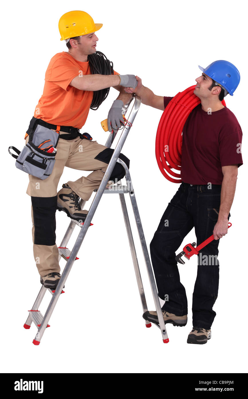 two electrician stood with step-ladder Stock Photo - Alamy