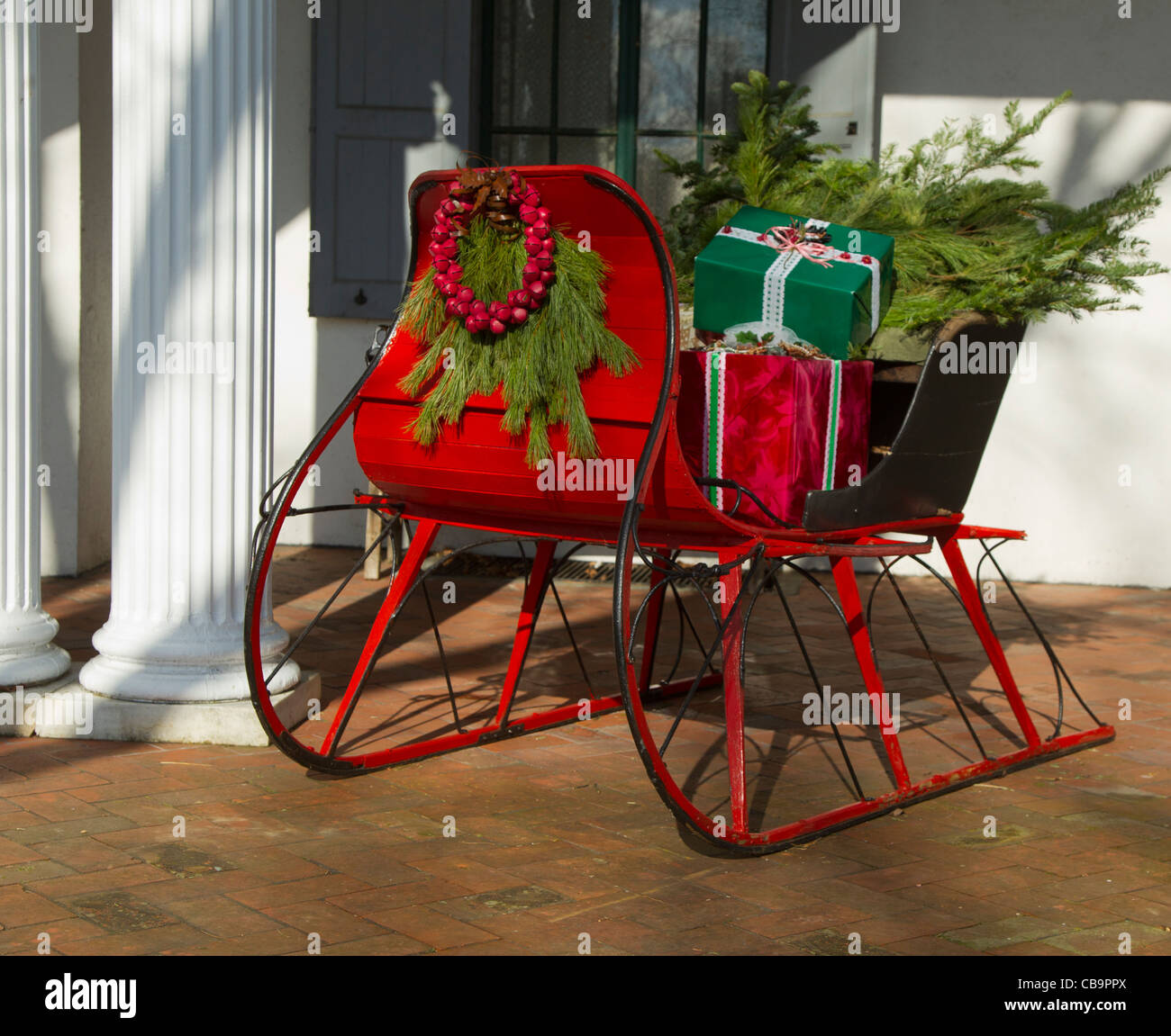 Victorian sleigh filled with Christmas presents Stock Photo - Alamy