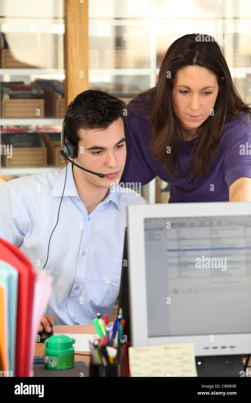 Teleoperator working in a call center Stock Photo - Alamy