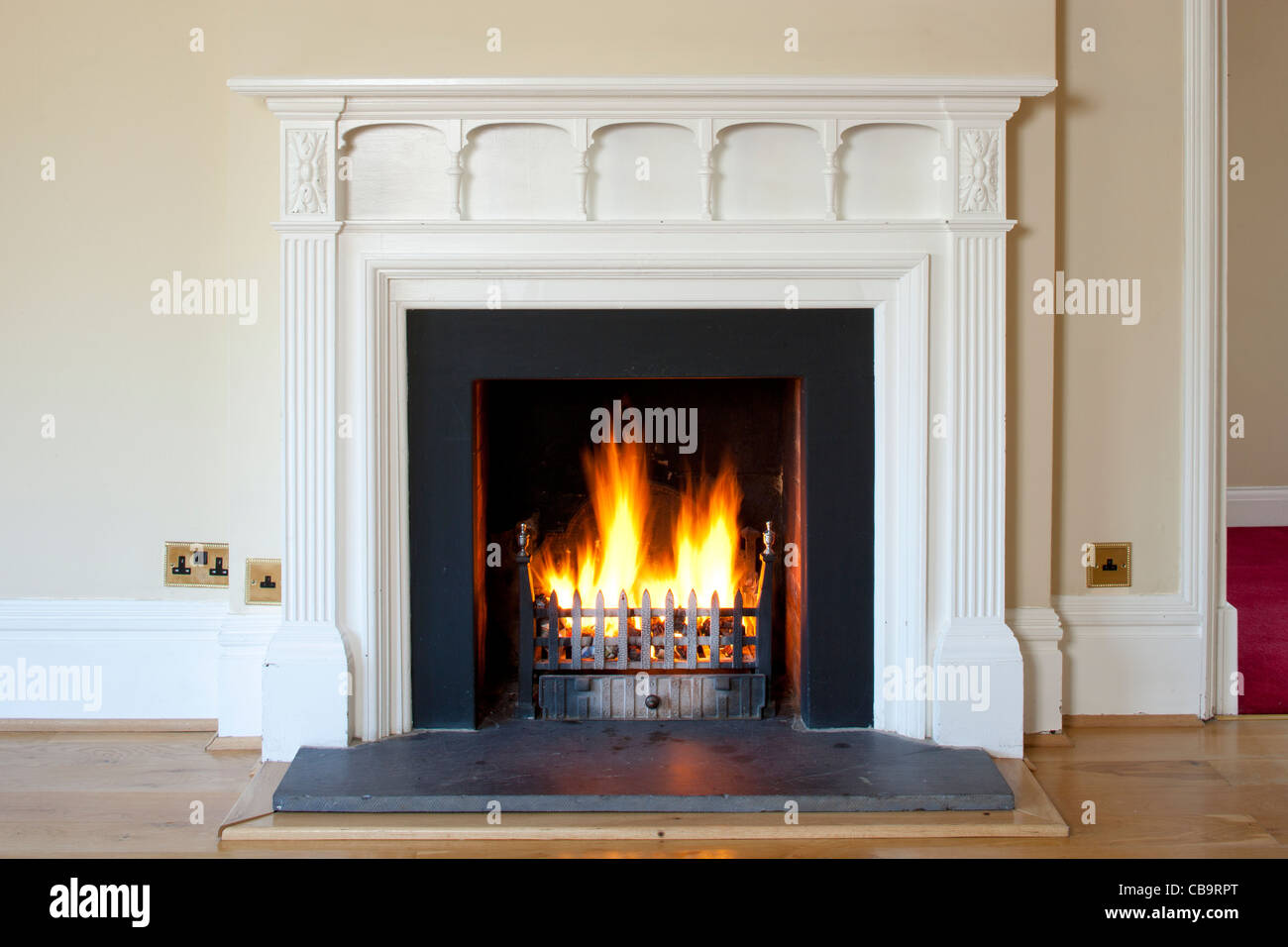 Classical fireplace with burning fire Stock Photo - Alamy