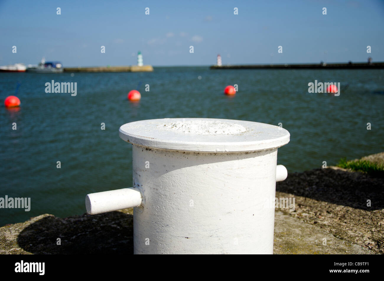 white wharf post in summer sea wharf Stock Photo - Alamy