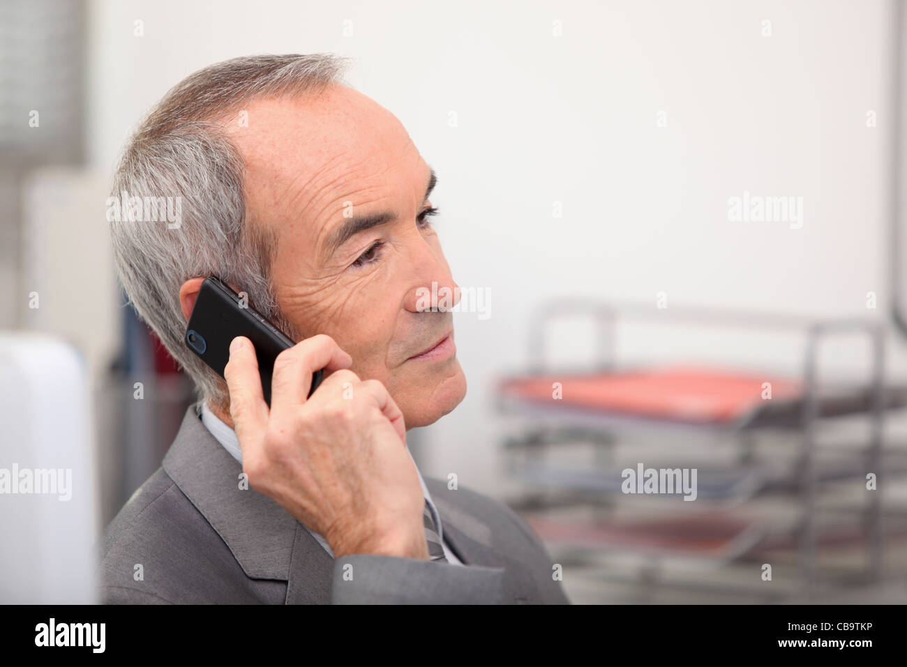 Senior man receiving phone call hi-res stock photography and images - Alamy
