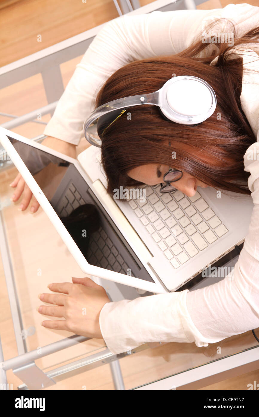 A woman sleeping on the Laptop Stock Photo - Alamy