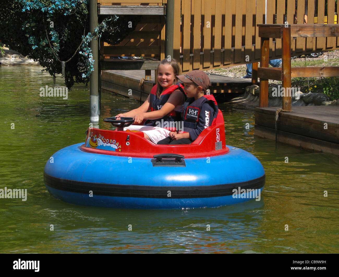 Boy and girl on a inflatable dinghy Stock Photo - Alamy