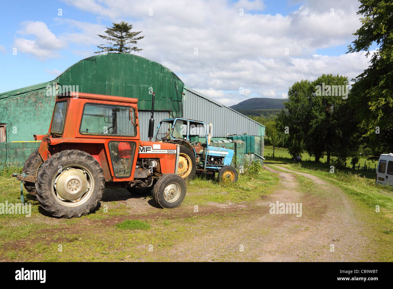 Two old tractors and barn on a farm near Kenmare, County Kerry, Ireland ...