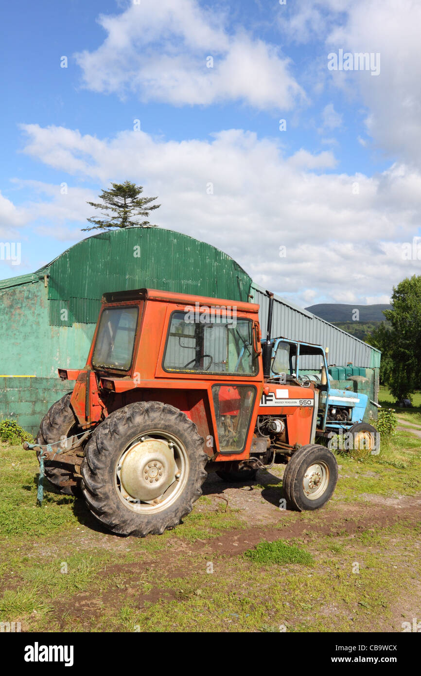 Two old tractors and barn on a farm near Kenmare, County Kerry, Ireland ...