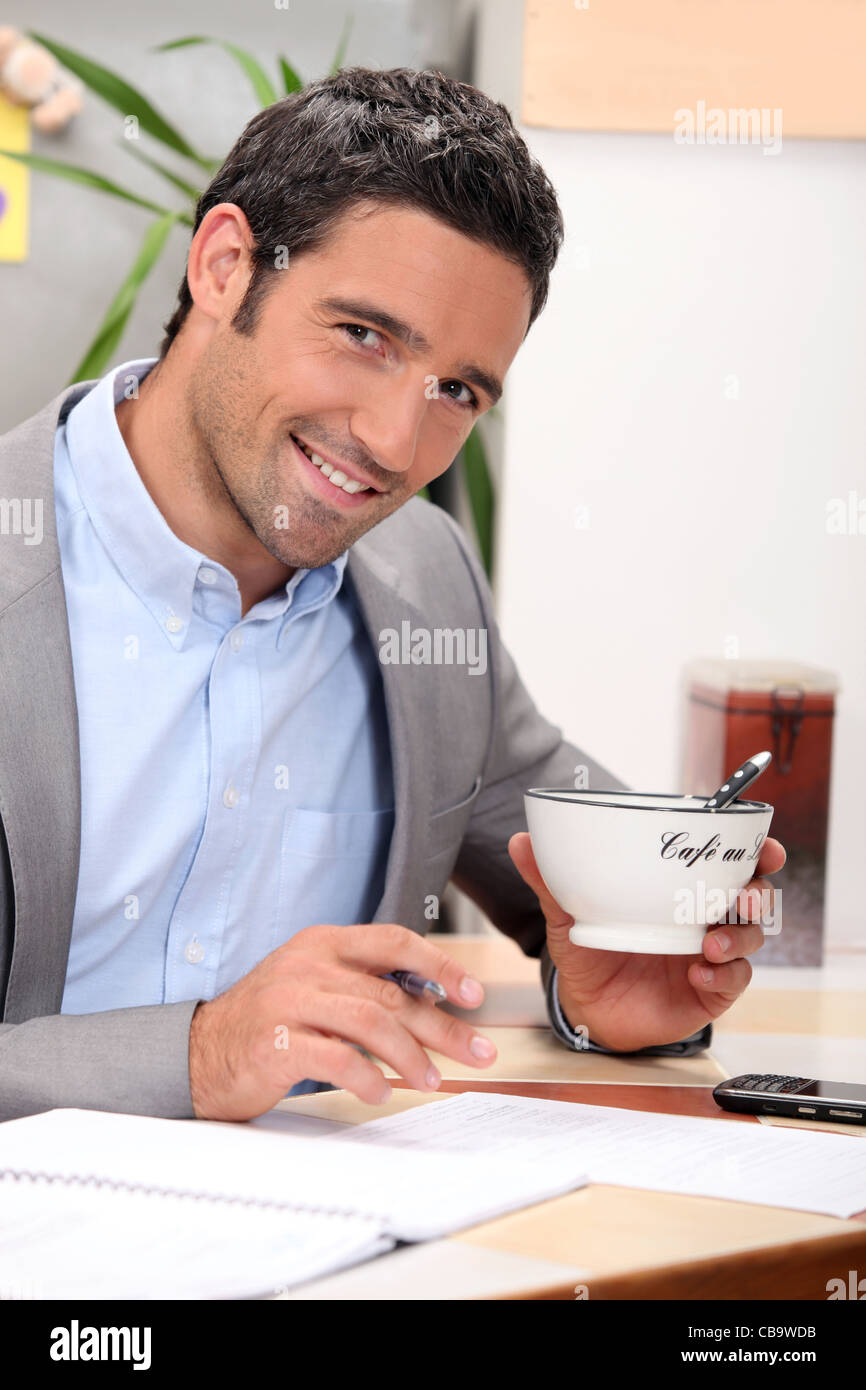Young writing during breakfast Stock Photo - Alamy